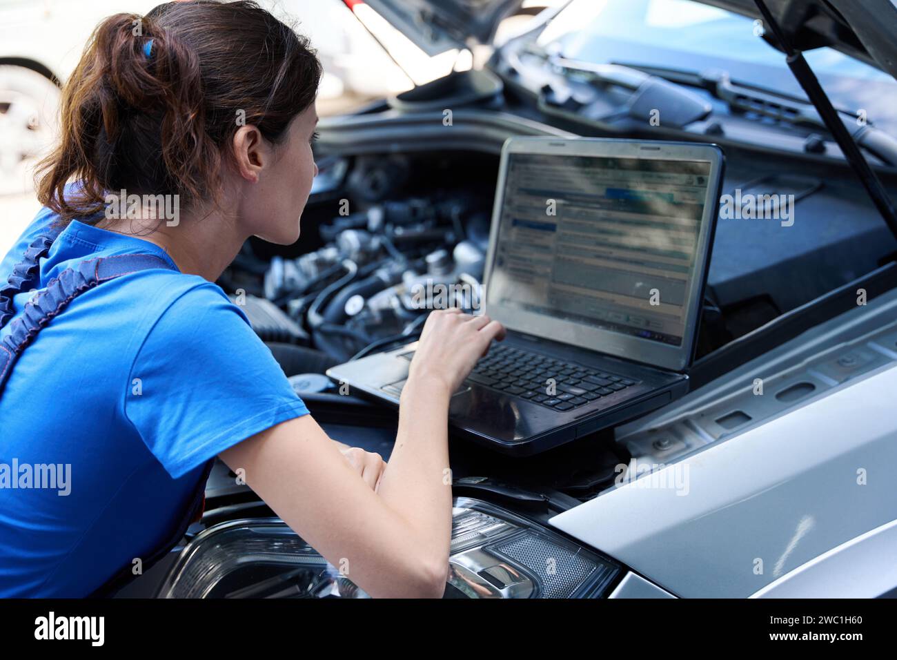 Caucasian female auto mechanic uses hi-res stock photography and images ...