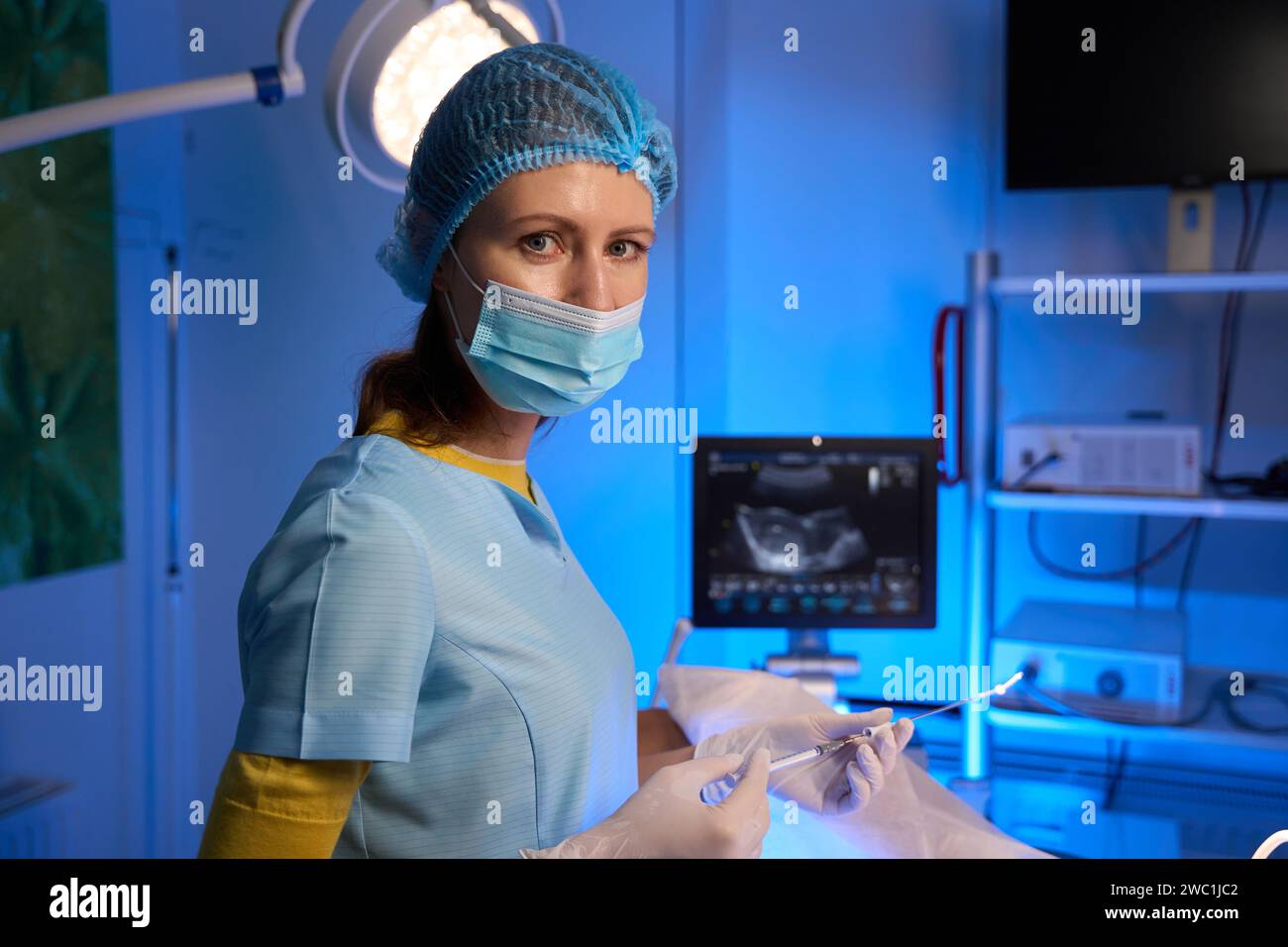 Female doctor using syringe for embryo transfer in reproductive clinic ...