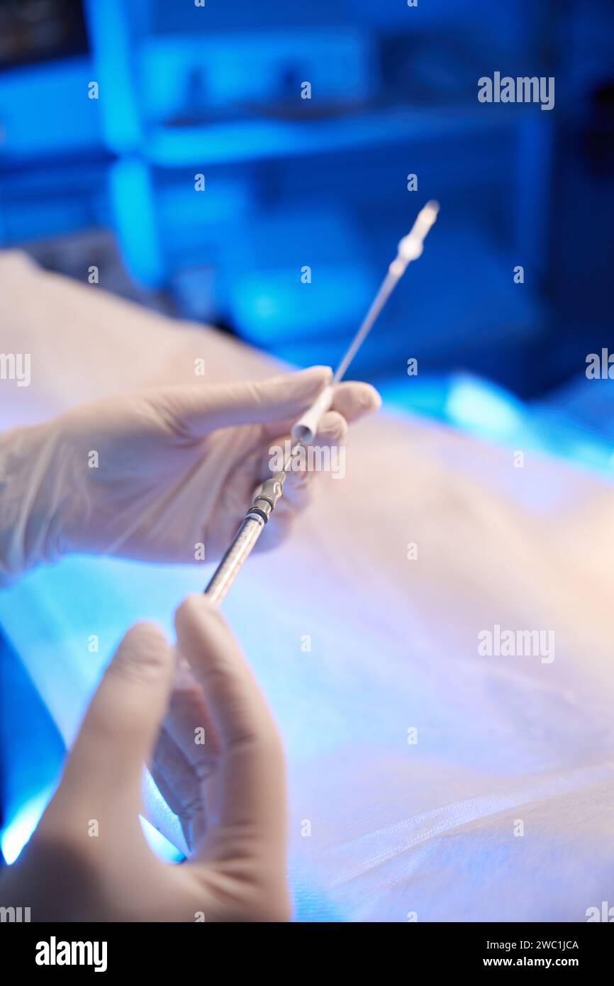 Selective focus of doctor hands using syringe for embryo transfer Stock ...