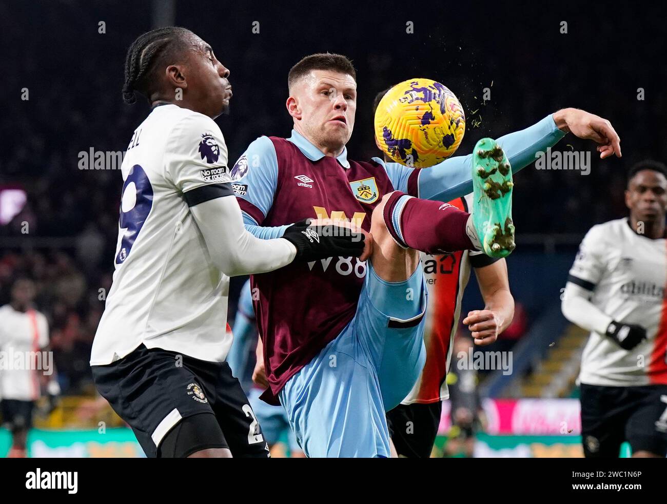 Burnley, UK. 12th Jan, 2024. Johann Gudmundsson of Burnley (R) is ...