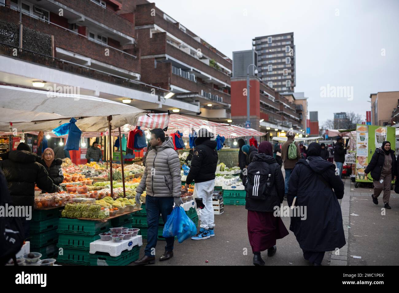 Watney Market, with blocks of tiered flats behind, Shadwell, East ...