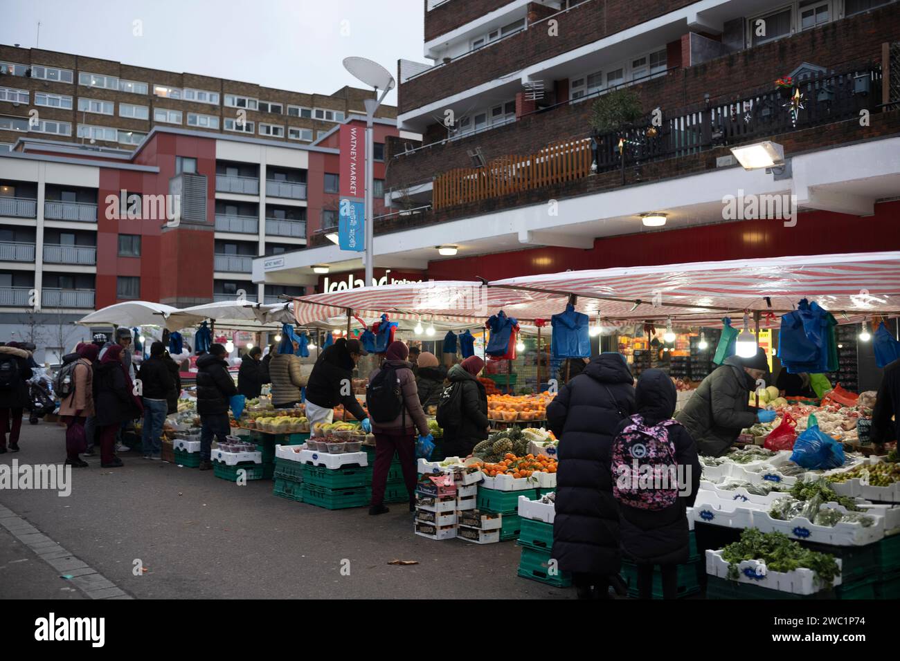 Watney Market, with blocks of tiered flats behind, Shadwell, East ...