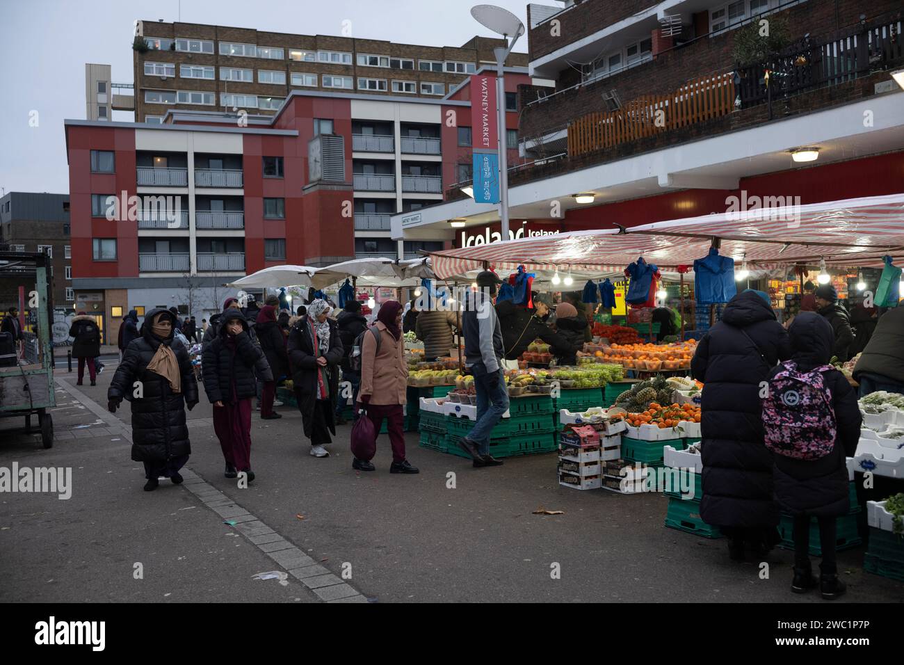 Watney Market, with blocks of tiered flats behind, Shadwell, East ...