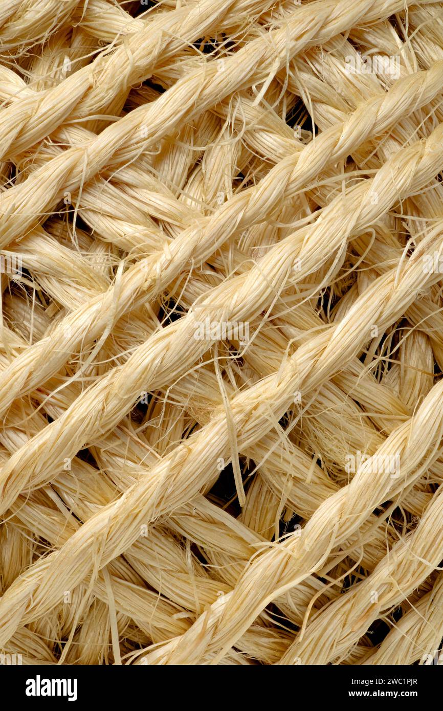 Roll of thick rough natural linen or sisal cord, close-up shot ...