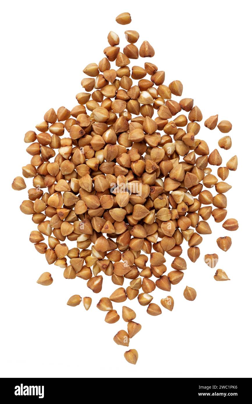 Pile of uncooked whole buckwheat grains, close-up shot, isolated on ...