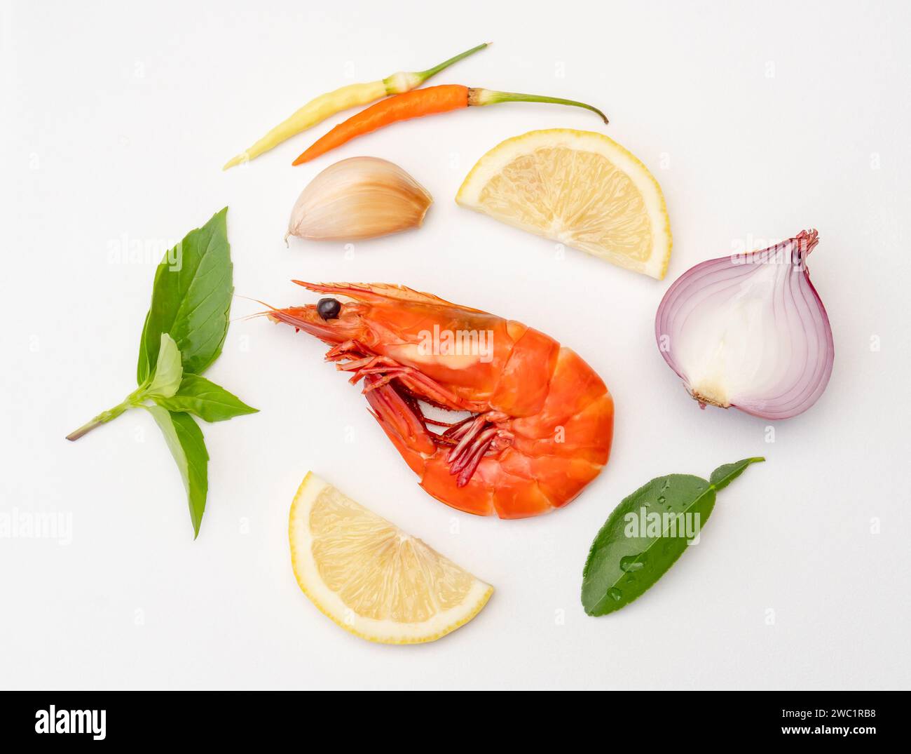 Single red cooked prawn or shrimp with spice or seasoning in set prepared for Thai prawn soup is ...