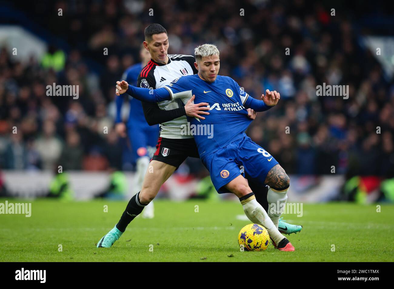 LONDON, UK - 13th Jan 2024: Enzo Fernandez of Chelsea holds off the ...
