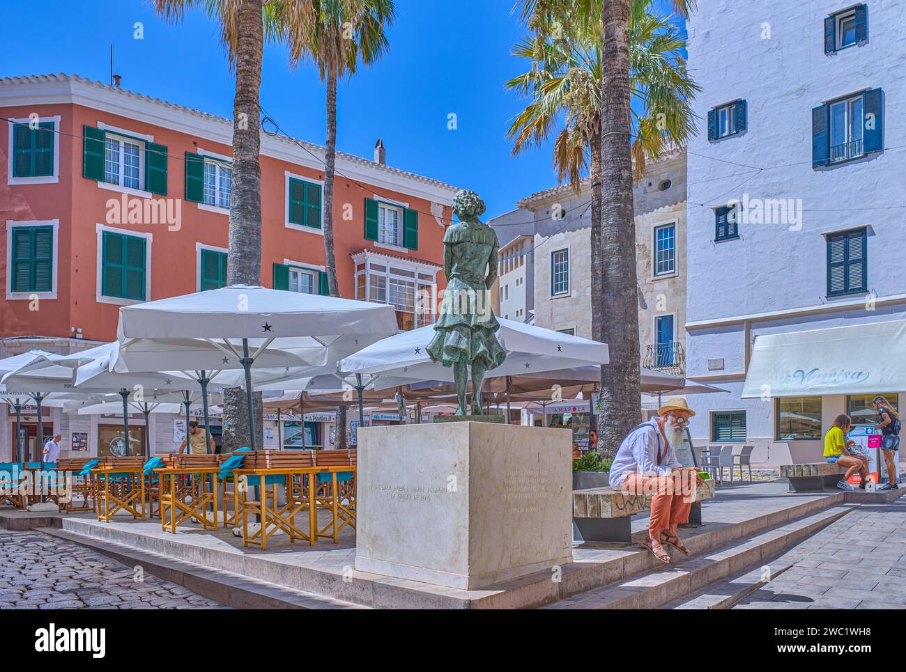 Mahon/Menorca, Spain - August 4, 2022: Tourists in Colon square wih the ...