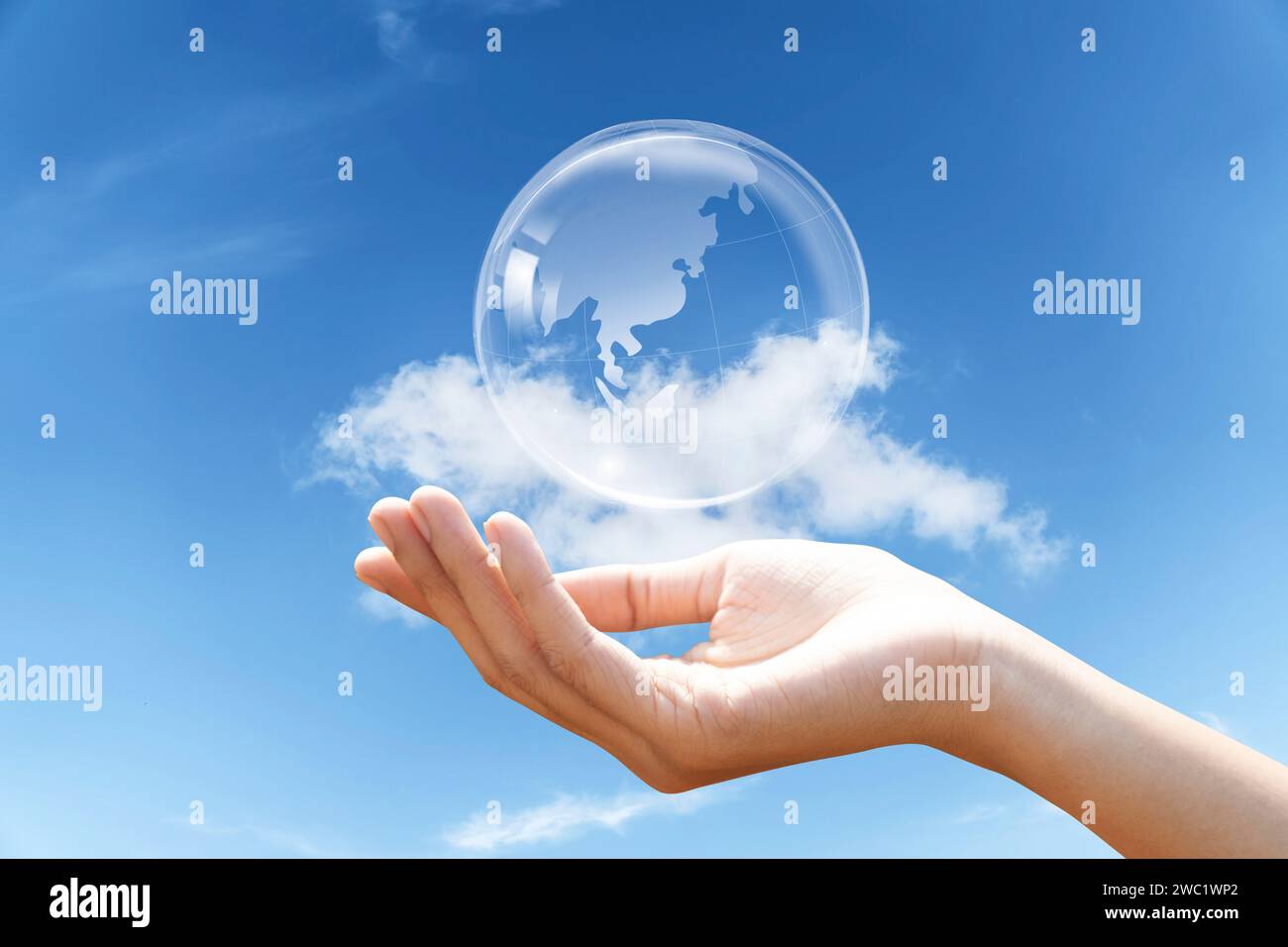Hand holding glass globe with ESG on blue sky background for ...