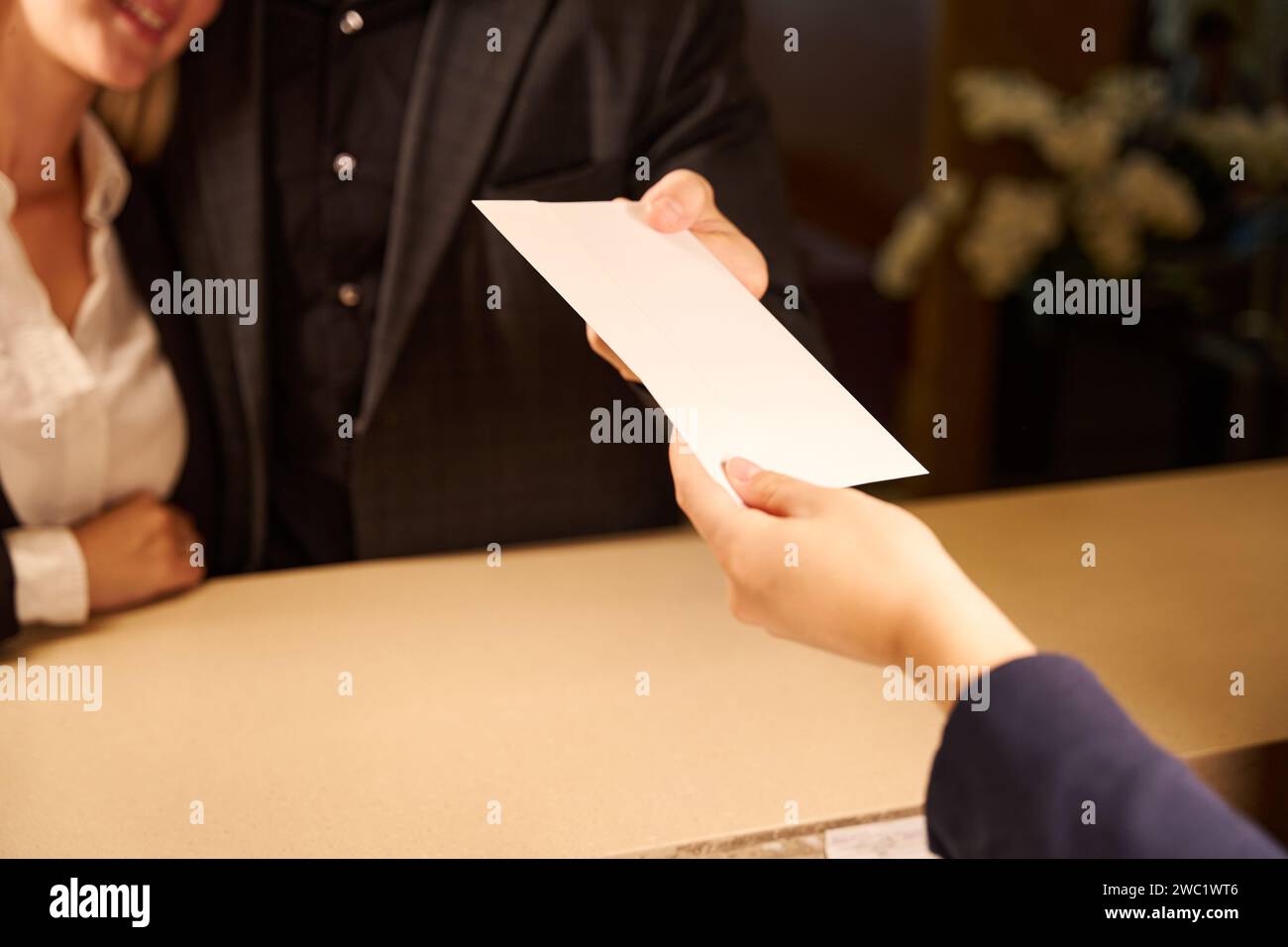 Cropped photo of female hand giving envelope to male hand Stock Photo ...