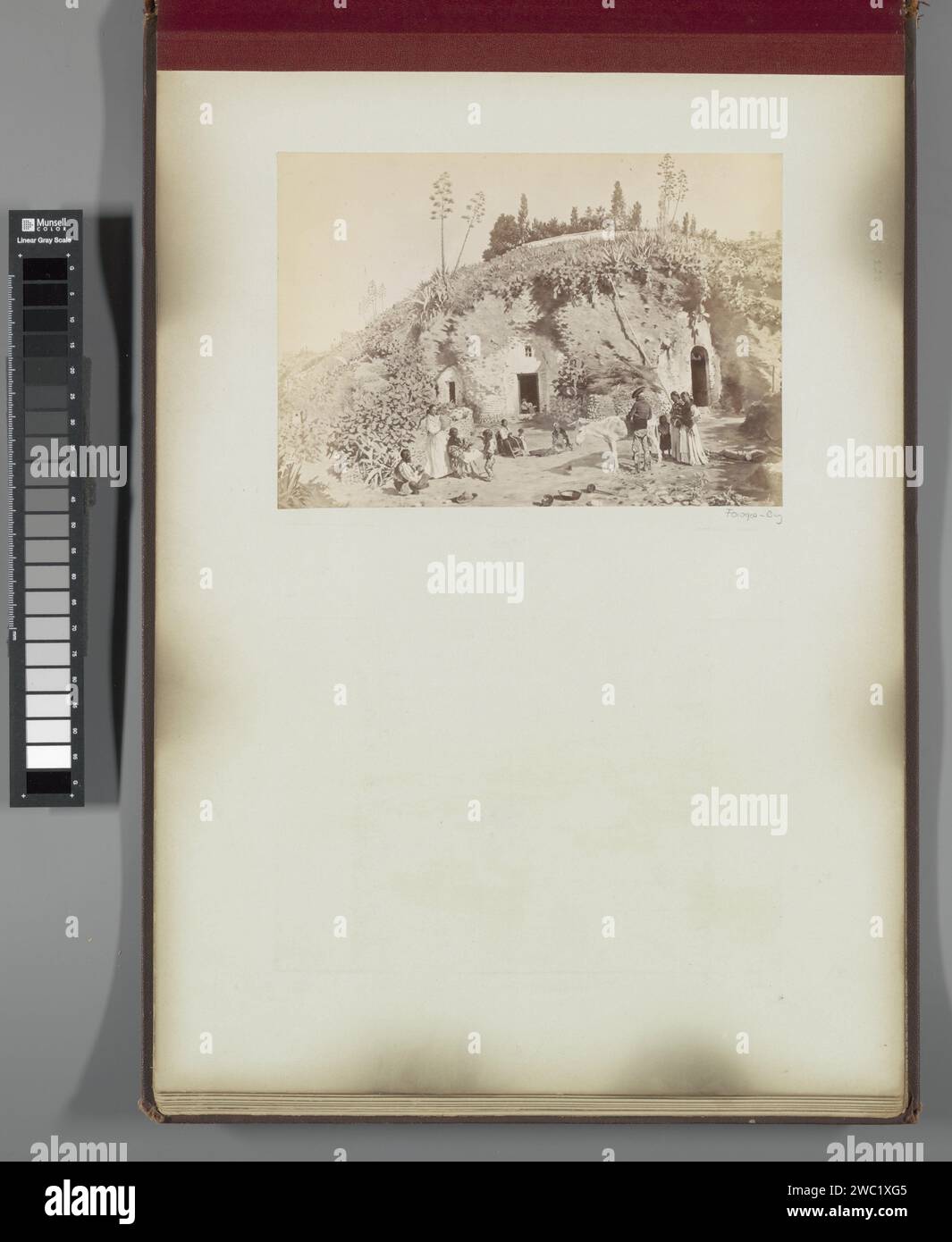 Photo production of (presumably) a drawing of Spaniards at a cave house ...