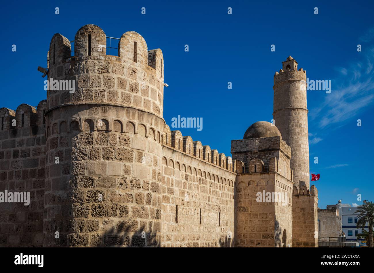 The imposing walls, ramparts and tower of the 8th century religious ...
