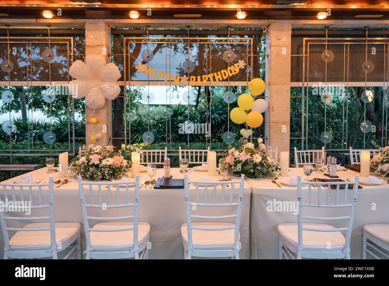 Setting up a banquet dining table with silverwave, wine glass for a ...