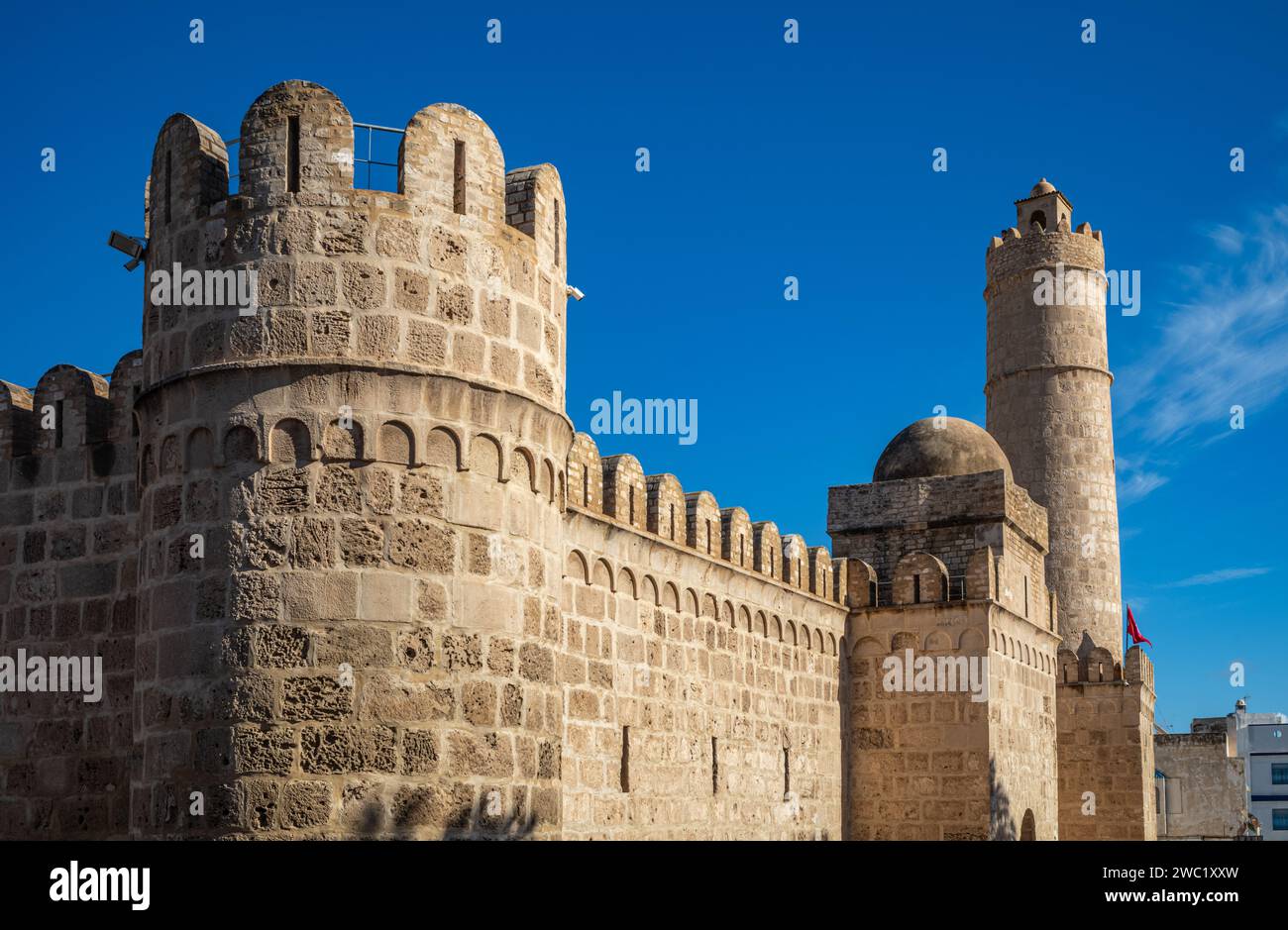 The imposing walls, ramparts and tower of the 8th century religious ...