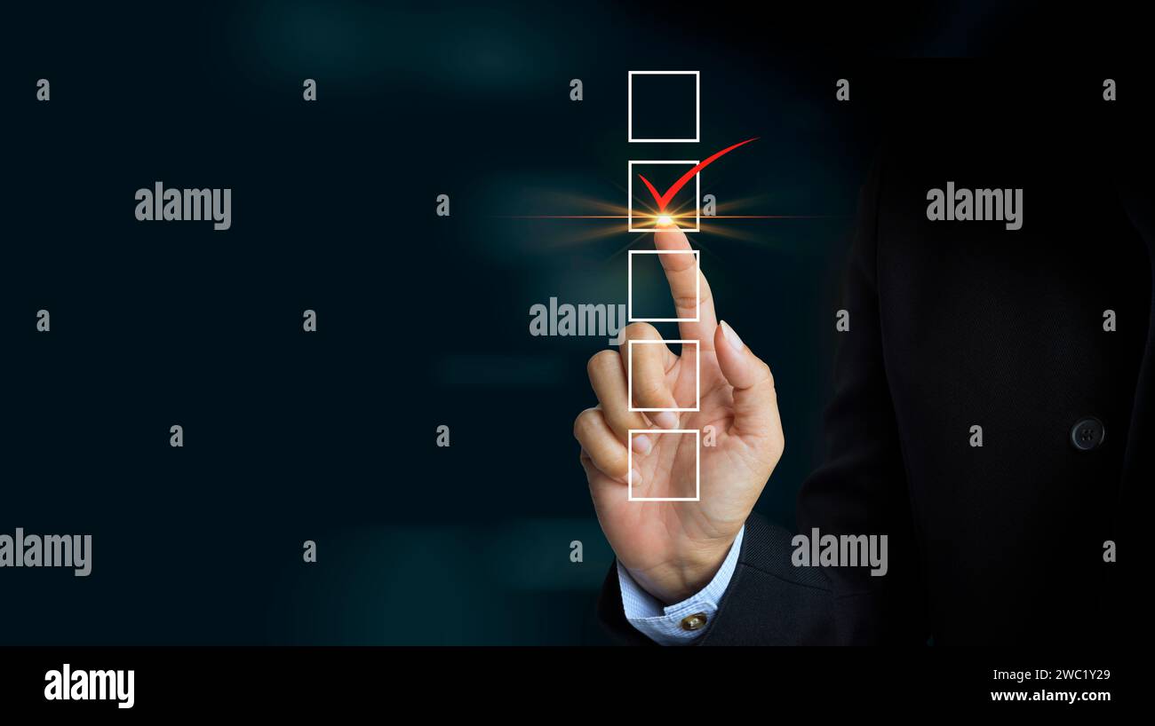 Checklist and Quality Assurance Concept. Businessman marks on check box ...