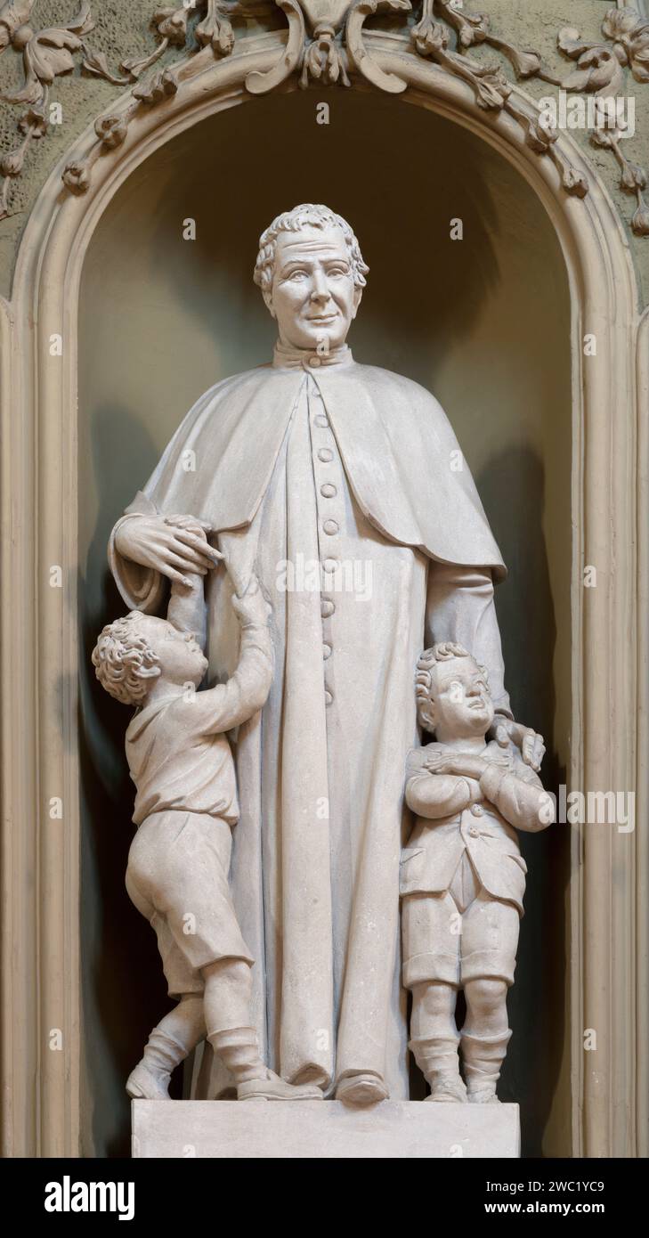 VICENZA, ITALY - NOVEMBER 6, 2023: The carved statue of St. Don Bosco ...