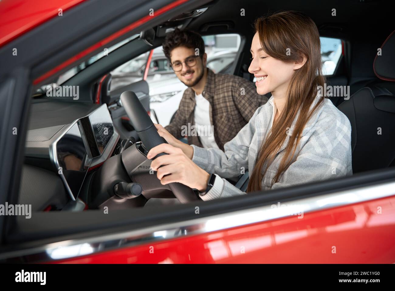 Woman testing modern car sitting hi-res stock photography and images ...
