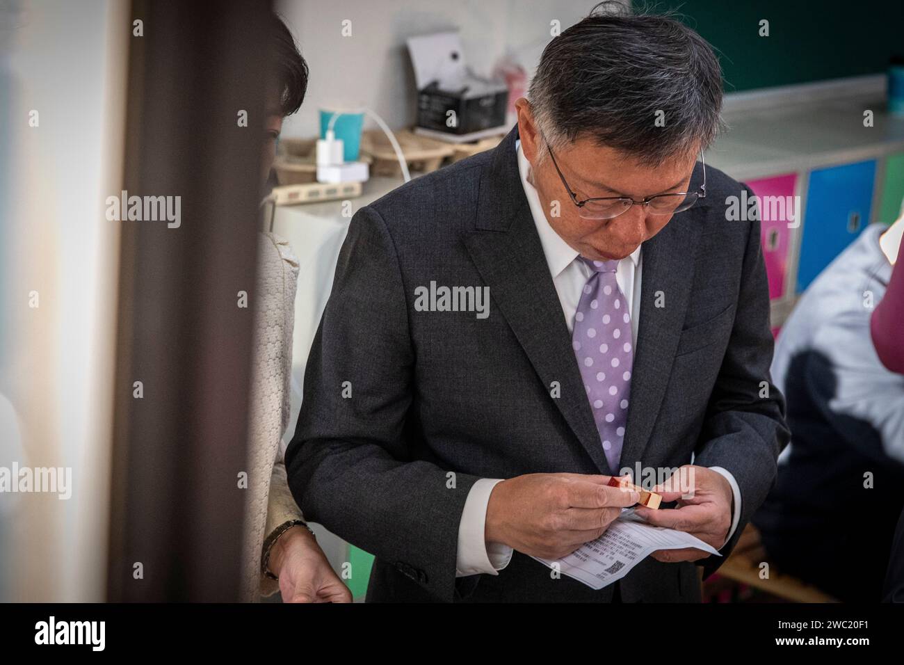 TPP President Candidate Ko Wen-je was holding his signature stamp at ...