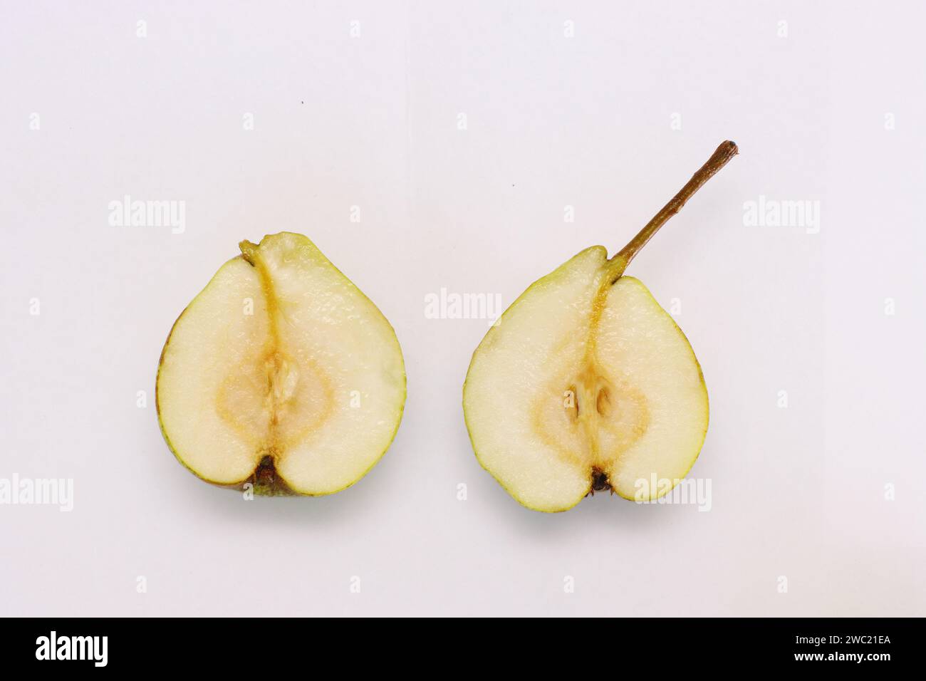 One pear cut in half top view Stock Photo - Alamy