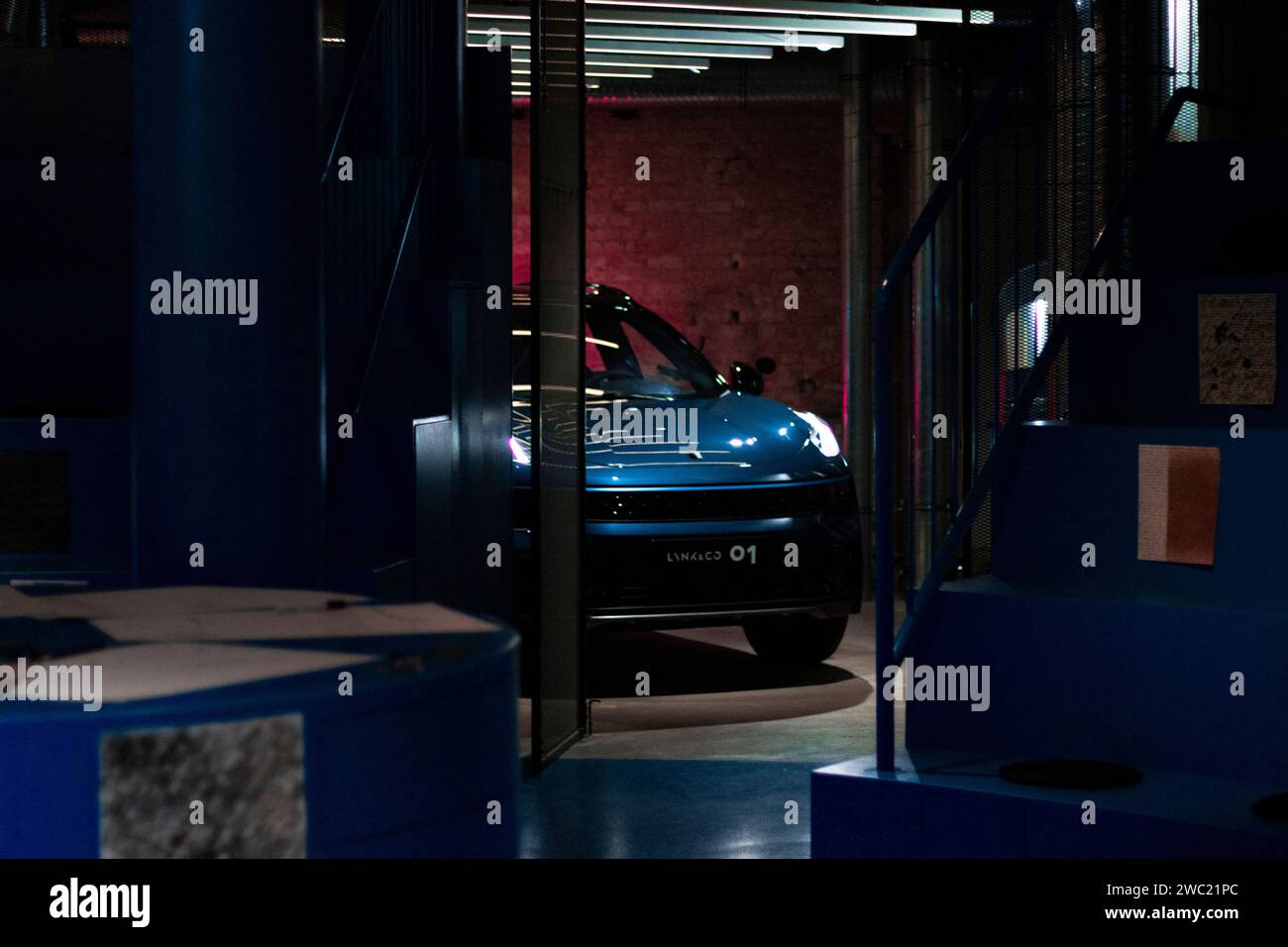Blue car in showroom Stock Photo - Alamy