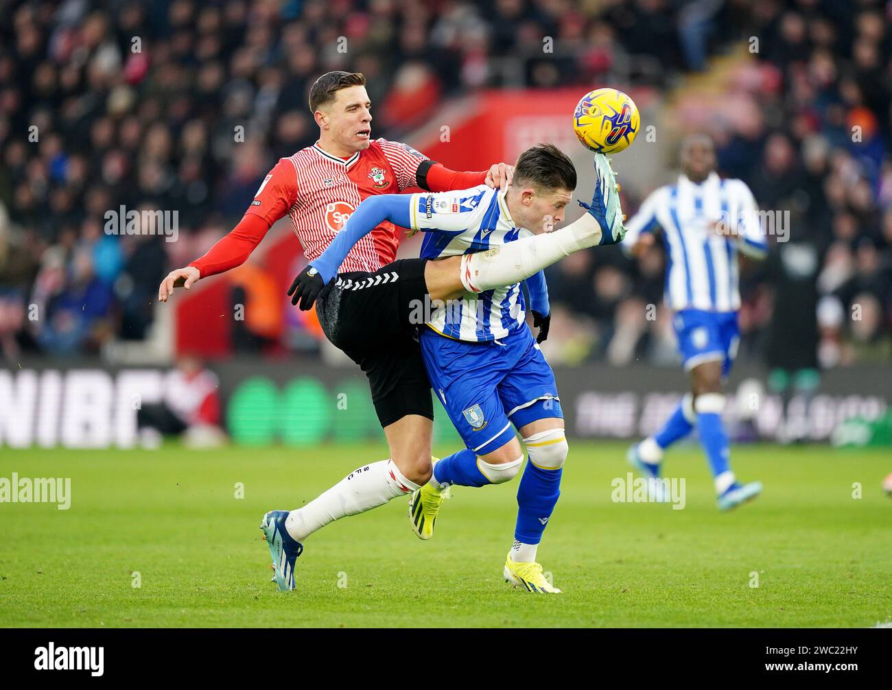 Southampton's Jan Bednarek (left) challenges Sheffield Wednesday's Josh ...