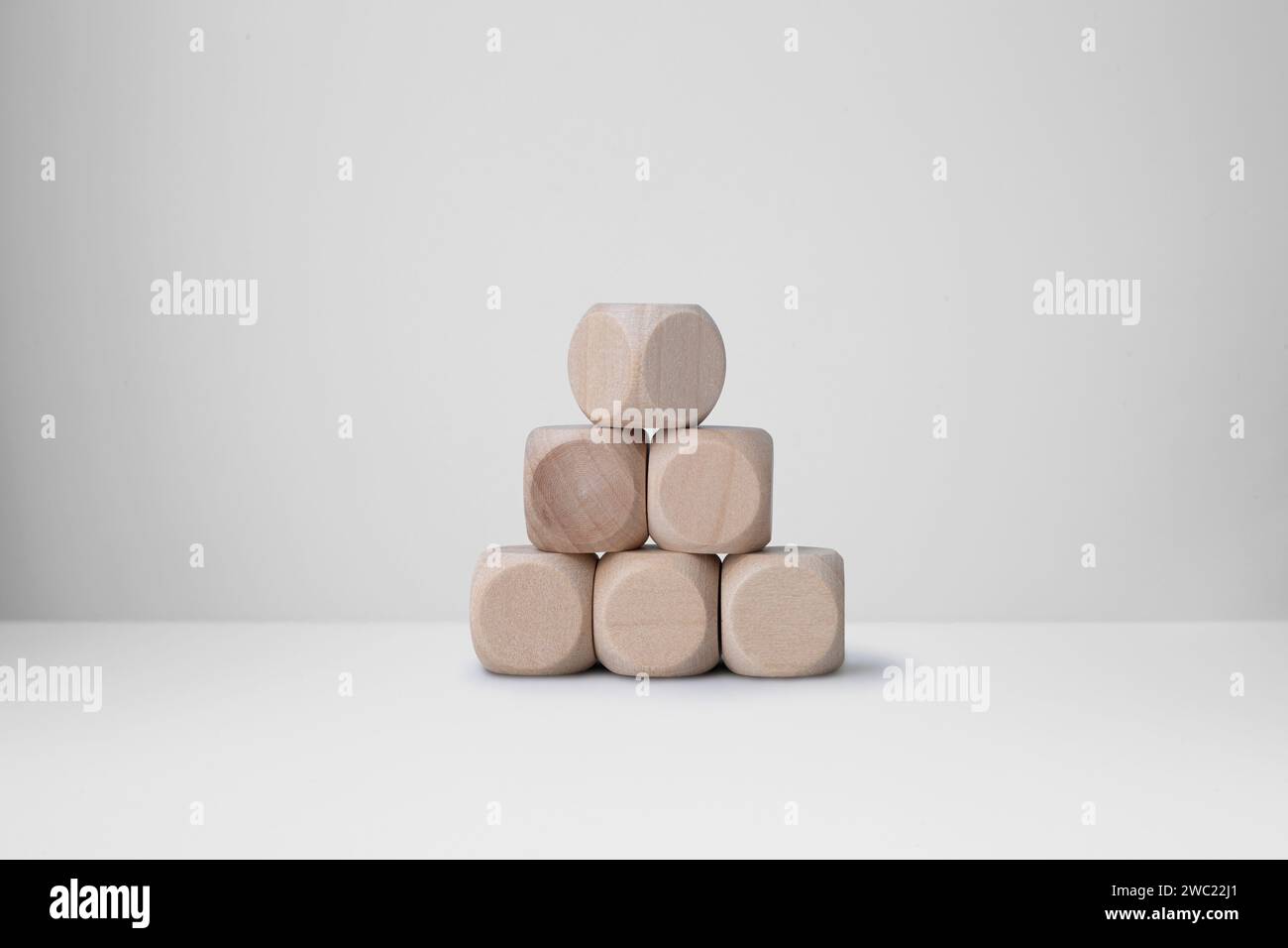construction from wooden cubes. It is isolated on a white background ...