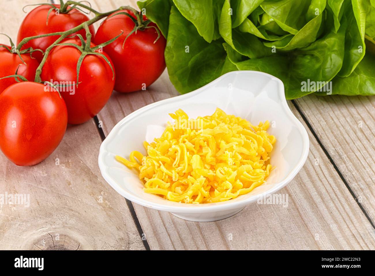 Shredded yellow cheese in the bowl Stock Photo - Alamy