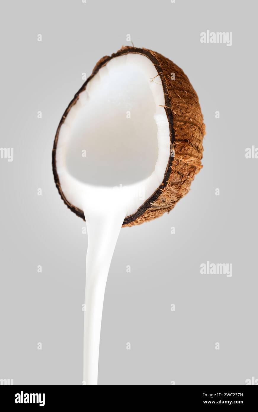 Coconut milk pouring front view isolated on white background Stock ...