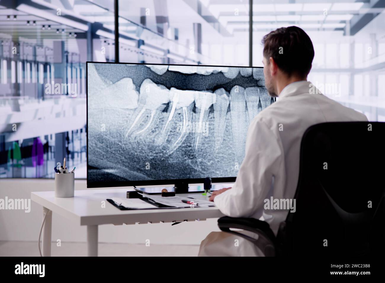 Radiologist Dentist Using X Ray Software On Desktop Computer Stock ...