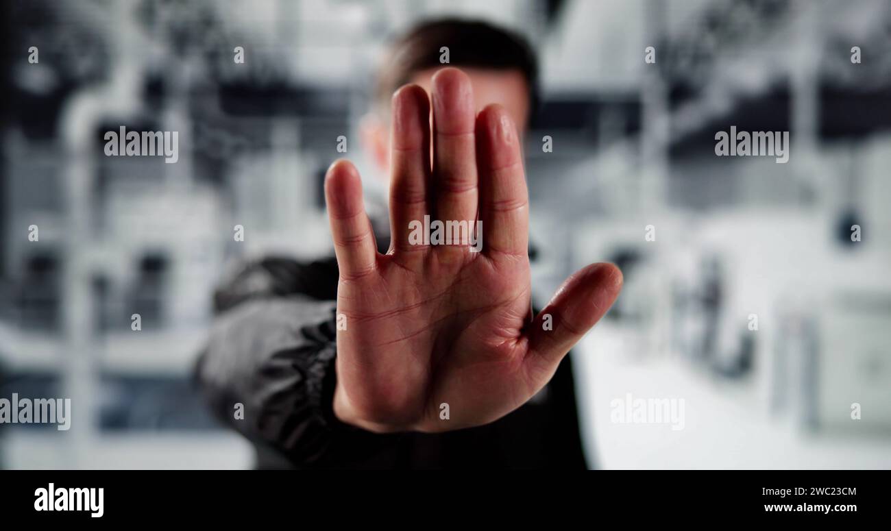 Security Guard Making Stop Gesture In Chip Factory Stock Photo - Alamy