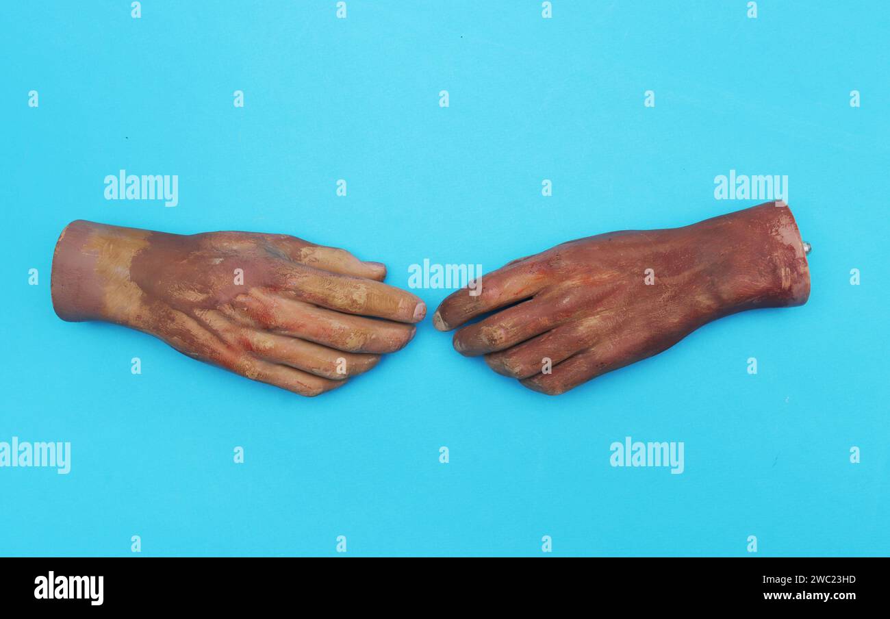 Artificial hands on blue paper background. Picture of artificial hands ...