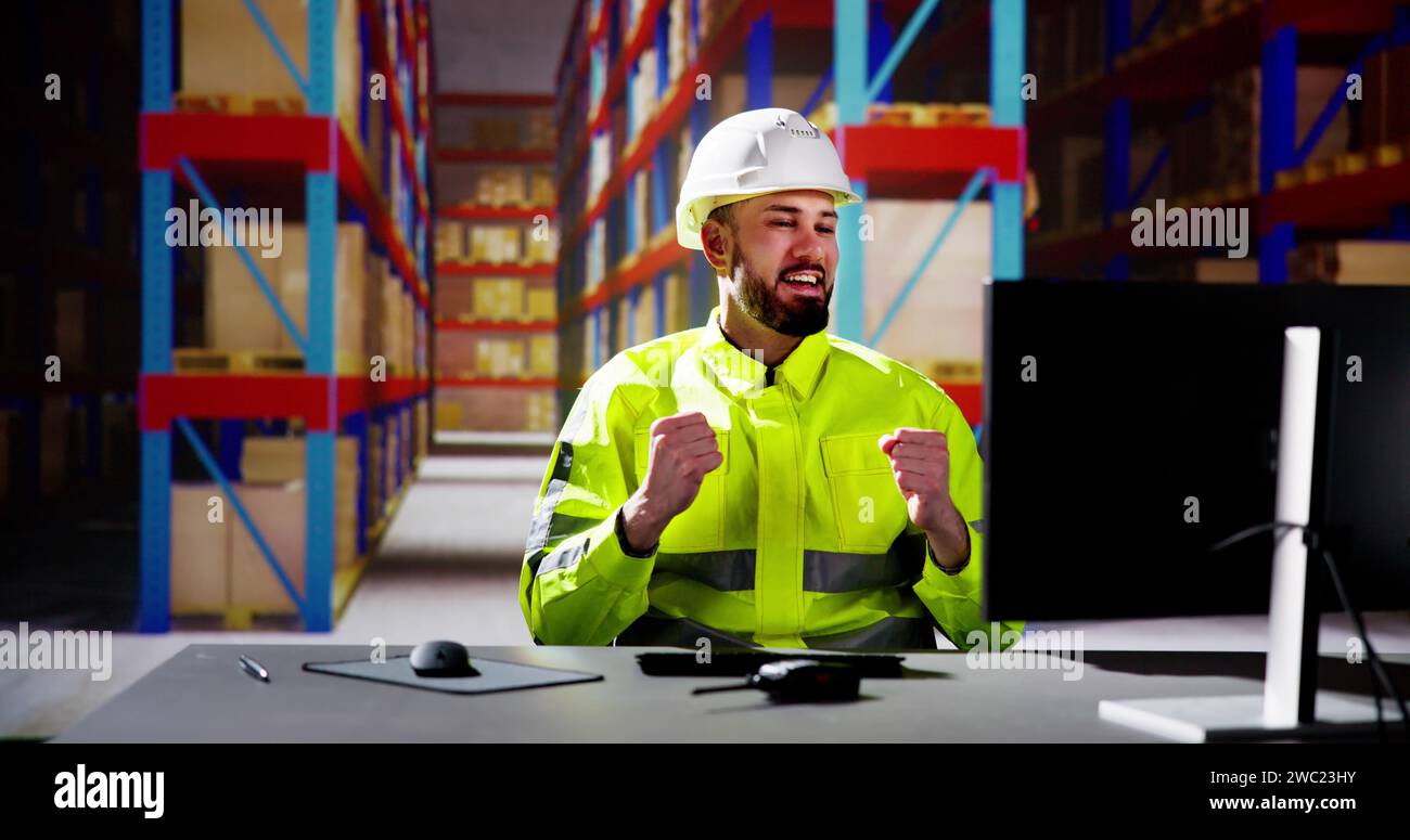 Excited Cheering Engineer Using PC In Automated Logistics Warehouse ...