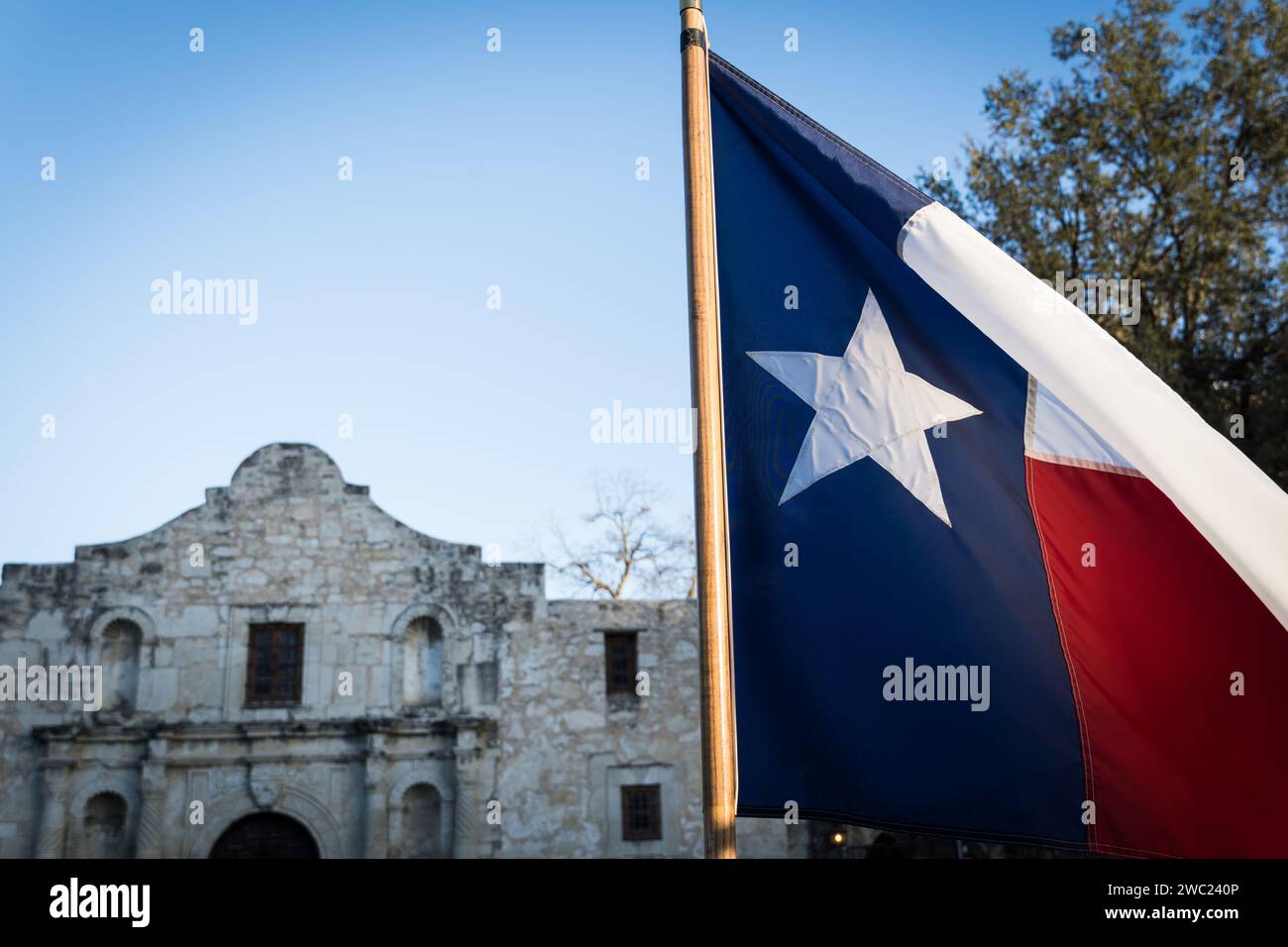 Texas flag waving in front of the Alamo in San Antonio Stock Photo - Alamy