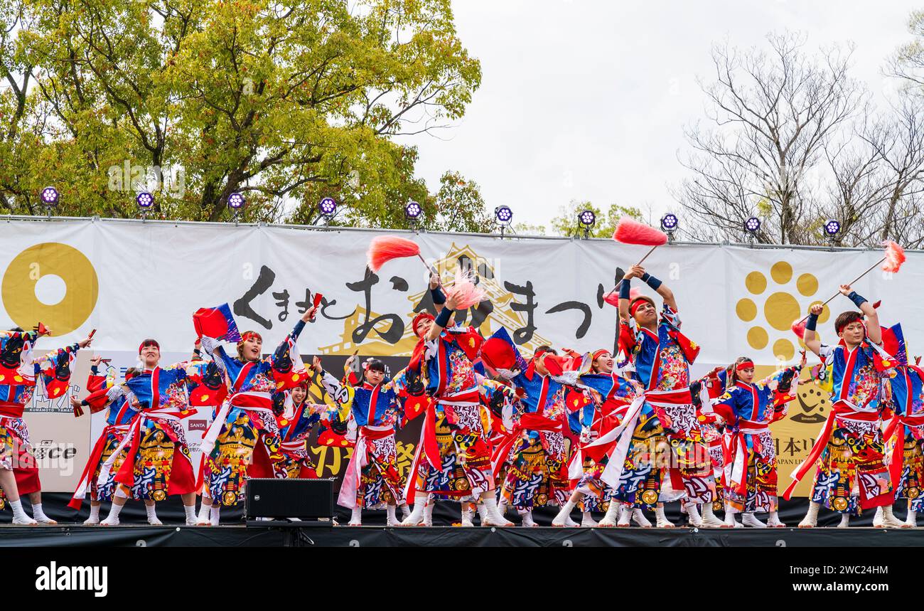 Japanese yosakoi dancers in bright multi-coloured costumes on open-air ...