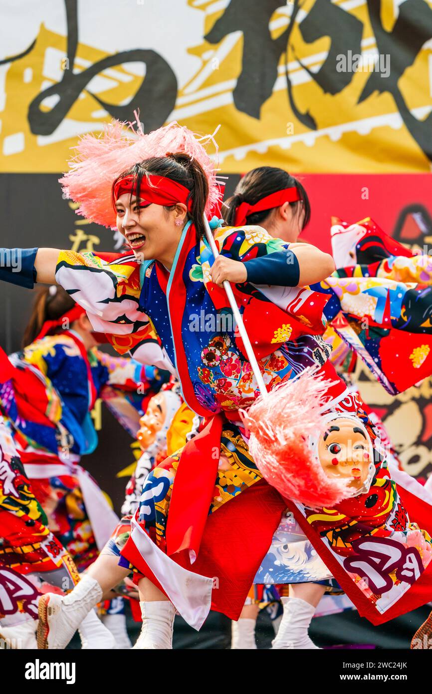 Close up, Japanese yosakoi dancers in bright multi-coloured costumes on ...