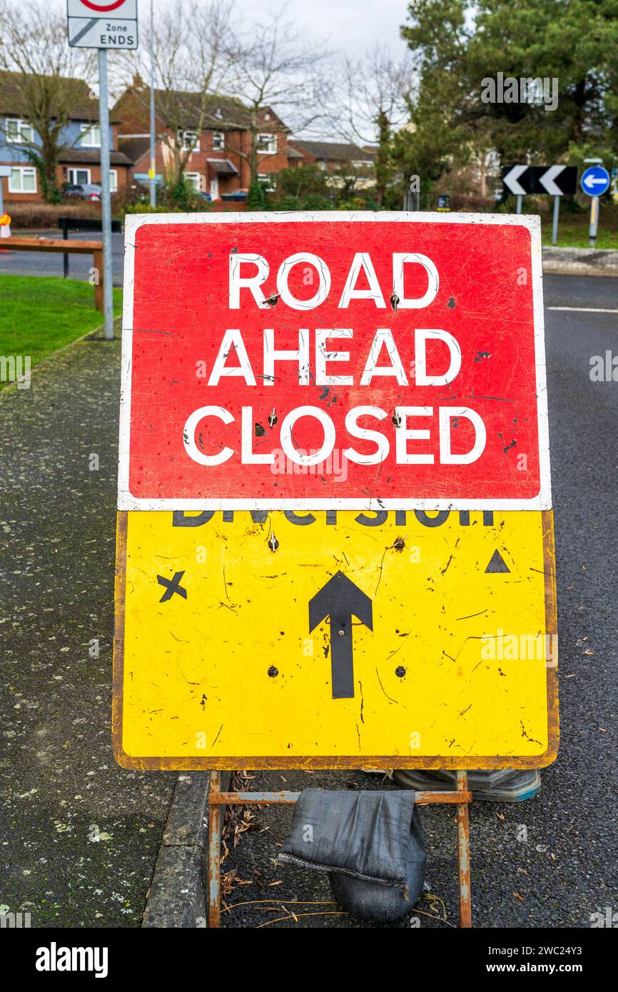 British red 'road ahead closed' sign with another yellow sign ...