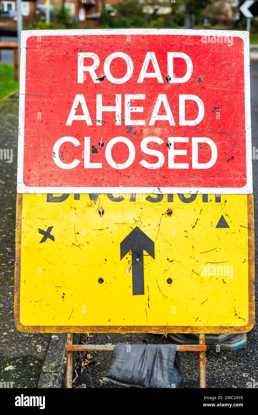 British red 'road ahead closed' sign with another yellow sign ...
