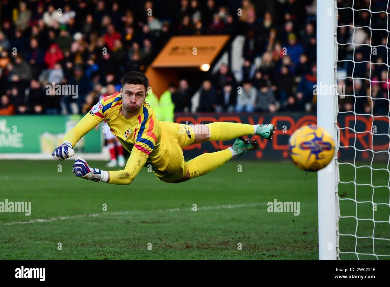 Goalkeeper Jack Stevens (1 cambridge united) dives as ball passes ...