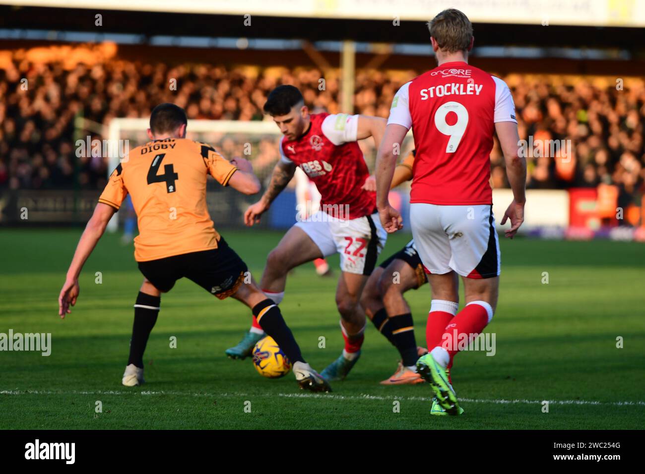 Callum Dolan (22 Fleetwood) challenged by Paul Digby (4 Cambridge ...
