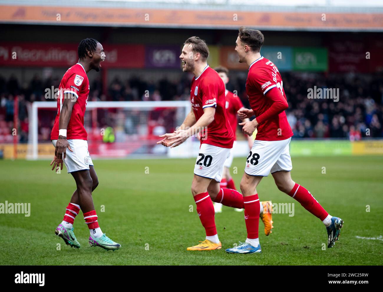 Crewe Alexandra's Elliott Nevitt (centre) celebrates scoring their side ...