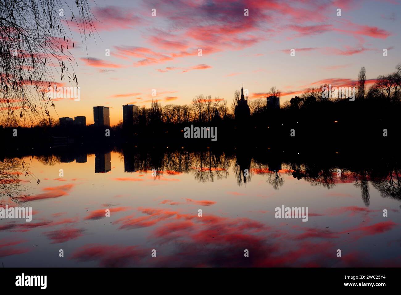 Twilight in Herastrau park in Bucharest, Romania, with red clouds on ...