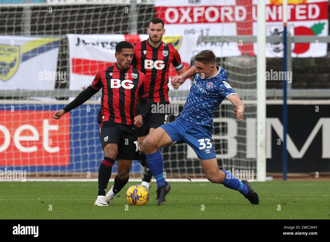 Harrison Neal of Carlisle United challenges Marcus McGuane of Oxford ...