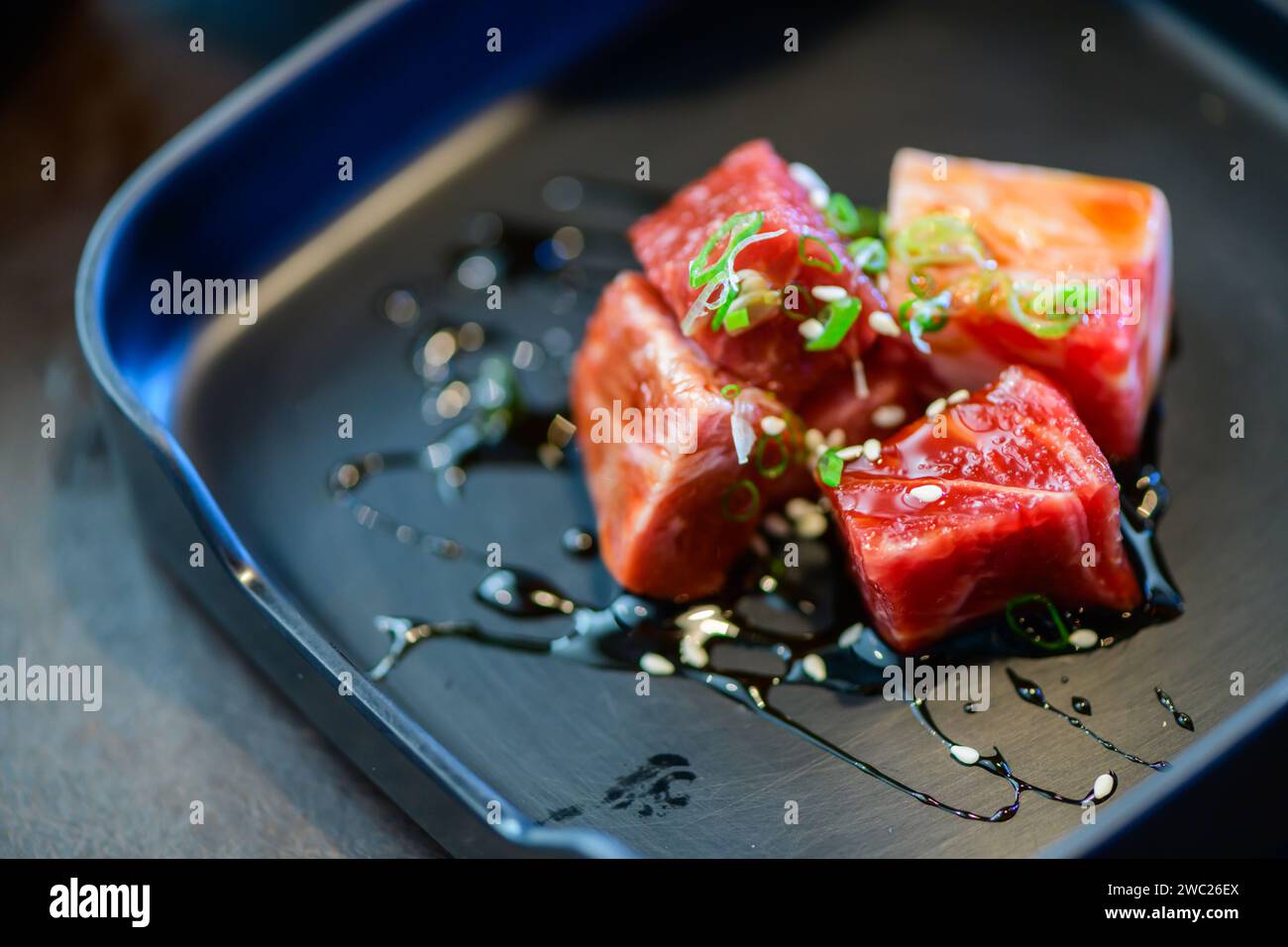 Premium Japanese wagyu diced beef cubes sliced on plate, meat concept ...