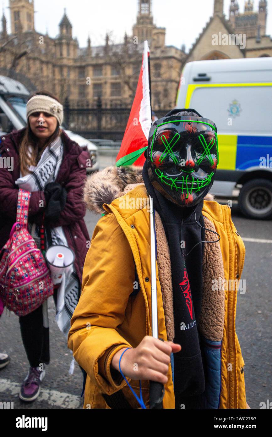 London, UK. 13th January 2024. Masked protestor.Pro-Palestine ...