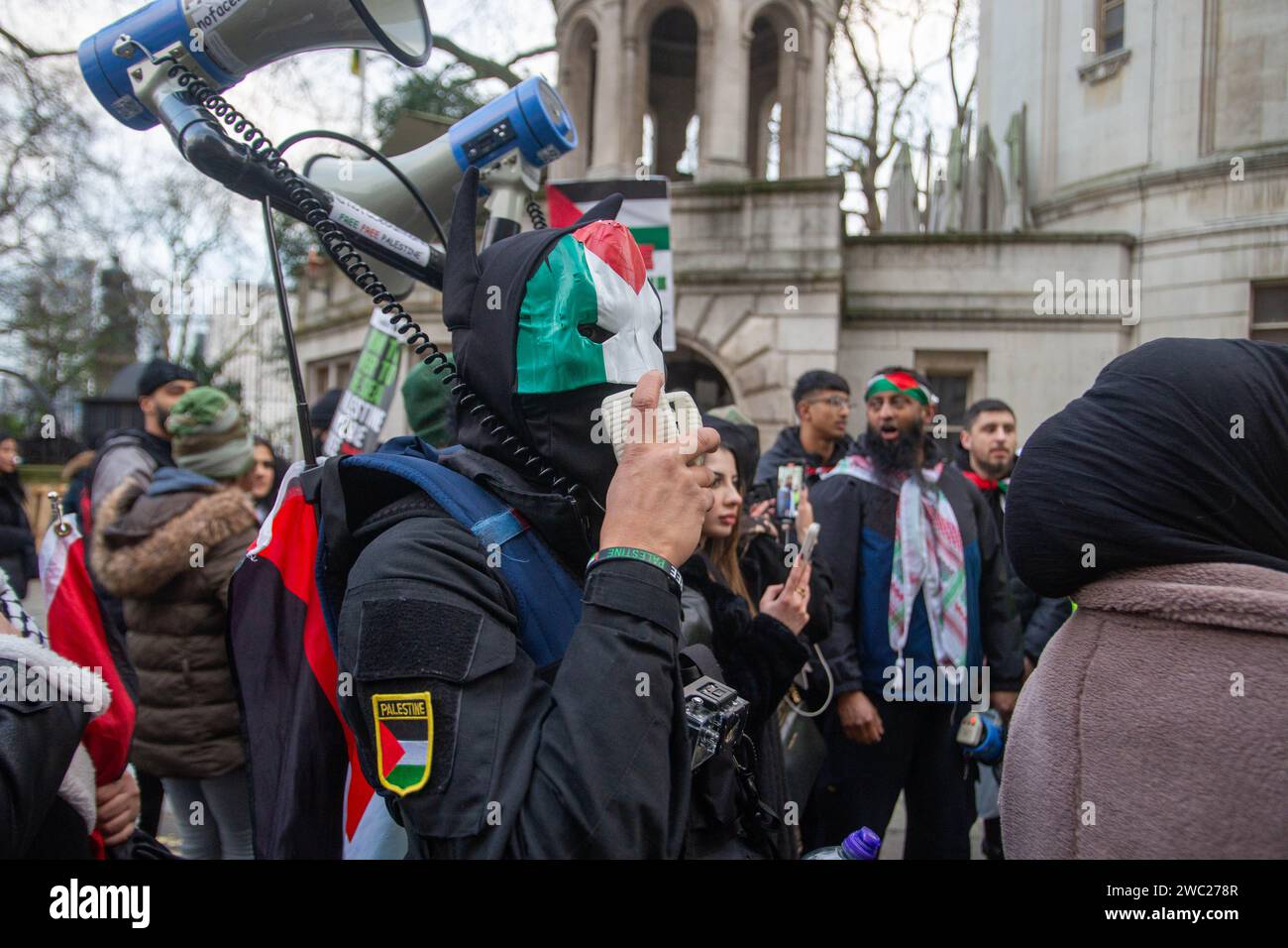 London, UK. 13th January 2024. No Face Bullhorn speaks to the police ...