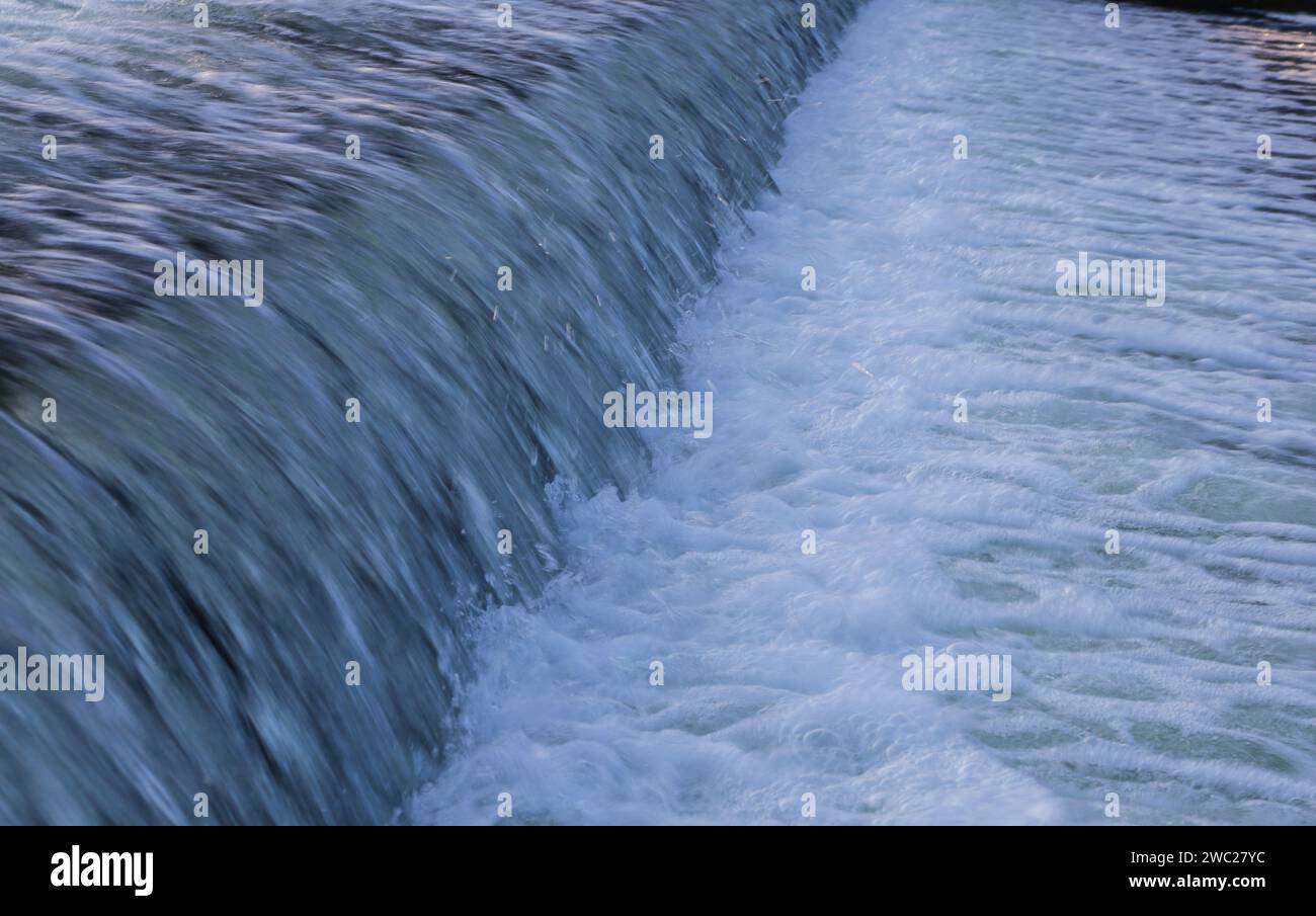 Downward flow of water from a body of water Stock Photo - Alamy