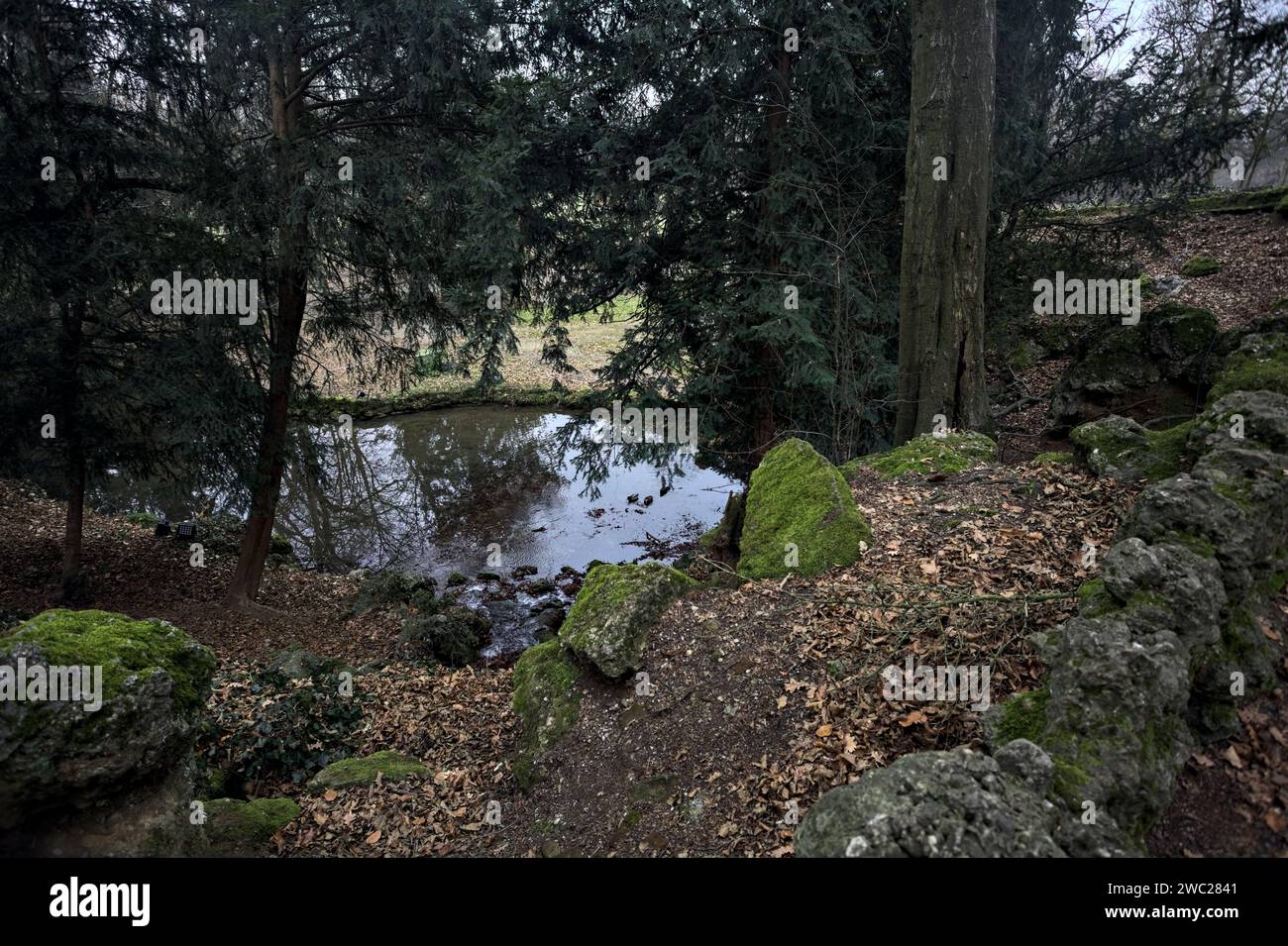 Pond at the bottom of a small waterfall in a park in autumn Stock Photo ...