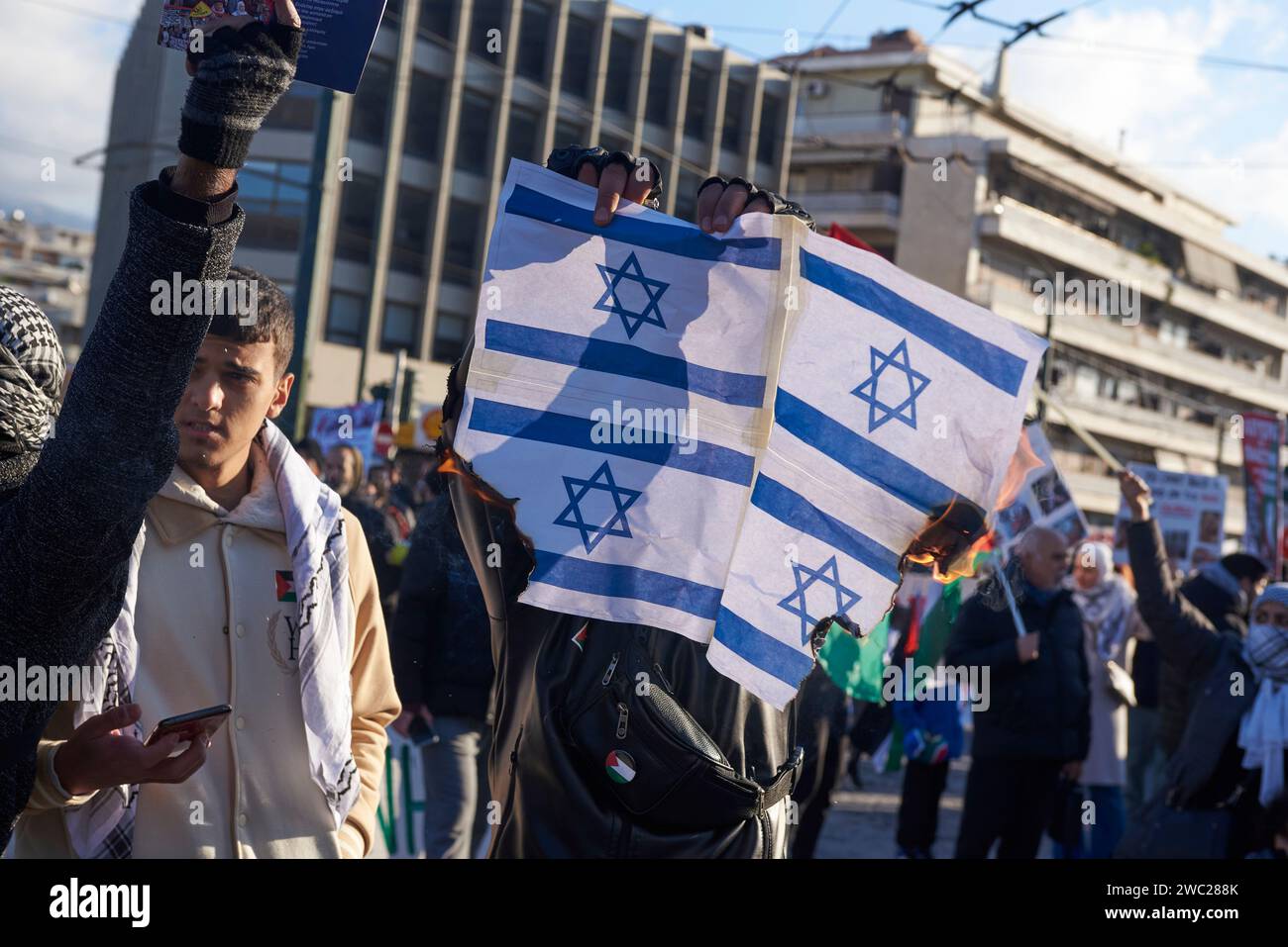Athens, Greece. 13th Jan, 2024. Palestinians burn an israeli flag in ...