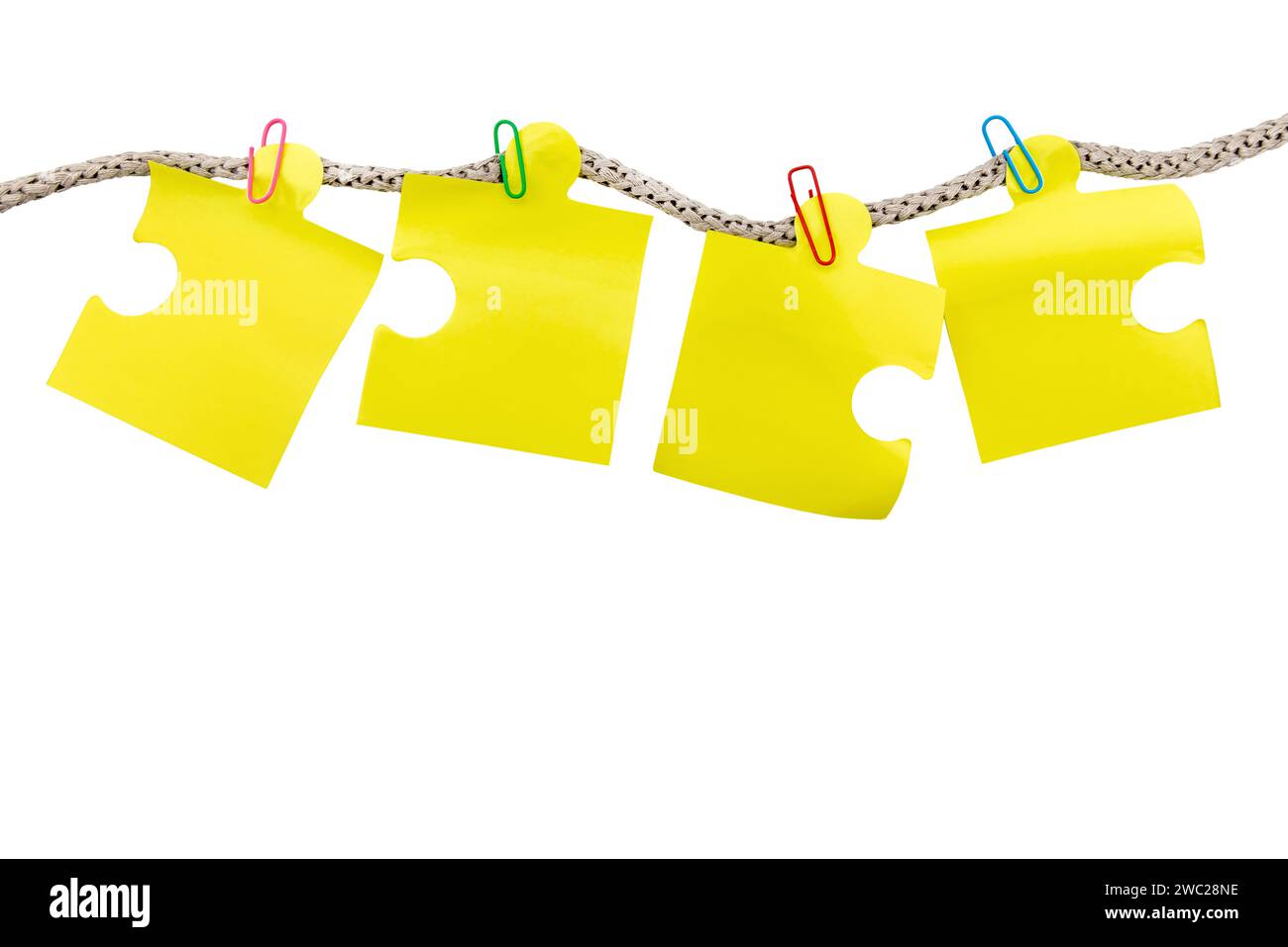 Yellow sheets of notes hanging on a rope on a white background. Sheets ...