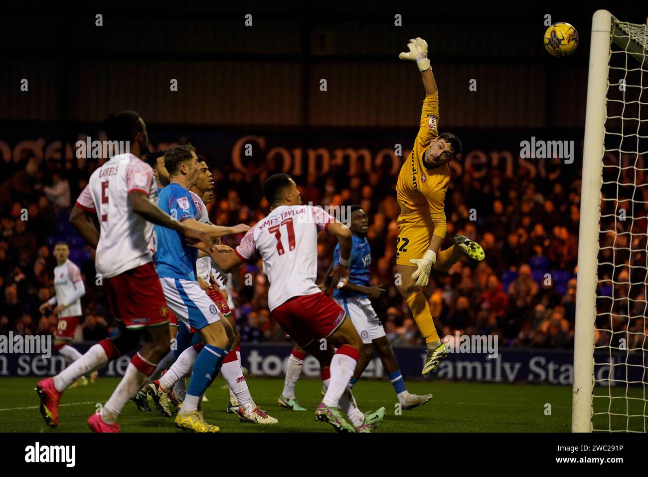 Walsall goalkeeper Jackson Smith (right) is unable to catch the ball as ...